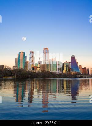 Austin Texas skyline buildings seen at night with full moon and Lady ...