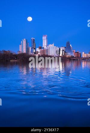Austin Texas skyline buildings seen at sunset with full moon and Lady ...
