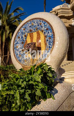 Sculpture with 'trencadís' on the dragon staircase, the entrance gate ...