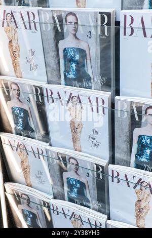 Harper's Bazaar magazines in a newspaper stand in the center of Milan ...