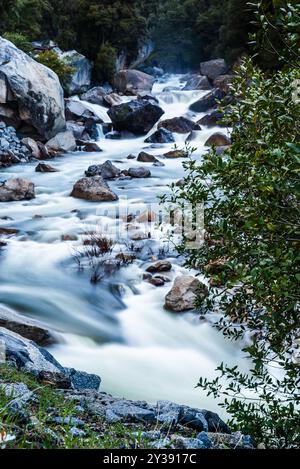 A rushing stream cascades over rocks in the Colorado Rockies Stock ...