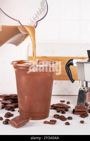 Viral Cracking Chocolate Latte drink. Plastic glass with cracked milk ...
