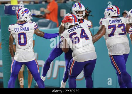 Buffalo Bills wide receiver Keon Coleman, center, is tackled by ...