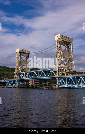 A double deck lift bridge crossing a river Stock Photo - Alamy