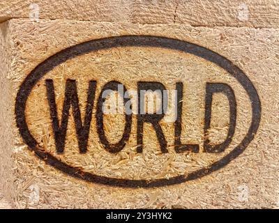 Word World burned into wood Stock Photo - Alamy