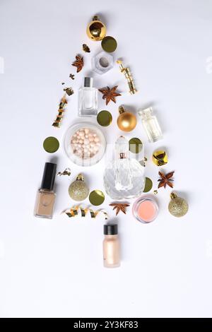 Christmas tree shape made of perfume bottles and cosmetic products on ...