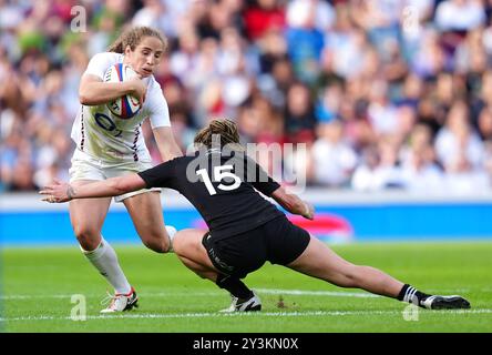 New Zealand's Renee Holmes, left, runs to score a try during the Women ...
