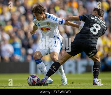 Brenden Aaronson of Leeds United is tackled by Casemiro of Manchester ...
