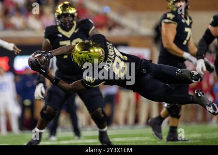 Mississippi wide receiver Deuce Alexander (11) is tackled by Georgia ...