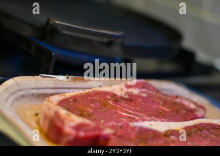 beef stake on a griddle hot plate pan Stock Photo - Alamy