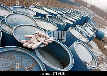 Steel oil rusted barrel tanks stacked in row in a warehouse.front view ...