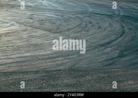 Tire track tread marks burnout on asphalt road, selective focus Stock ...