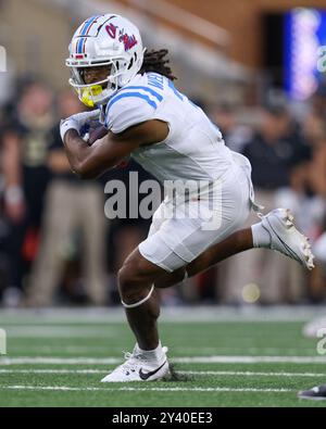 Mississippi wide receiver Antwane Wells Jr. after a catch runs the ball ...