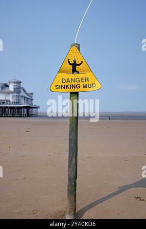a danger sinking mud sign on Weston-Super-Mare beach Stock Photo - Alamy