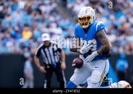 Los Angeles Chargers cornerback Eric Rogers (39) is helped off the ...