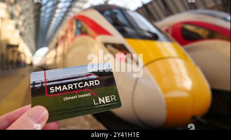 The LNER railway ticket against a background of Azuma trains at King's ...