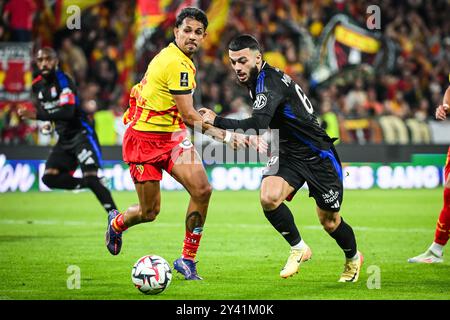 Facundo Axel MEDINA of Lens and Georges MIKAUTADZE of Lyon during the ...