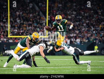 Green Bay Packers' Jayden Reed (11) runs past Detroit Lions' Jacob ...