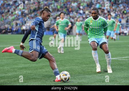 Seattle Sounders defender Jon Bell heads the ball against Houston ...