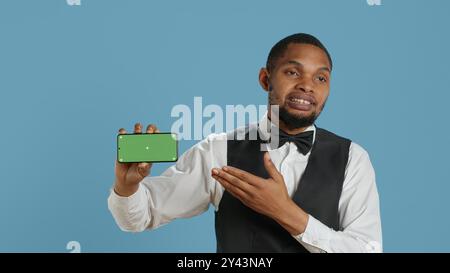 Bellman receptionist presenting an isolated mockup screen in studio ...