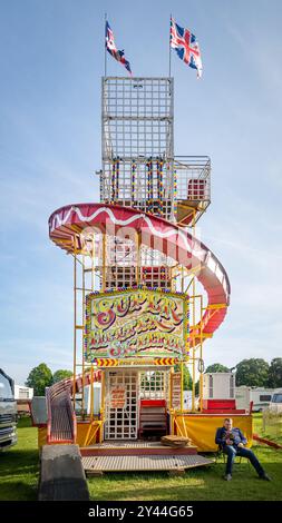Super Helter Skelter slide ride at British carnival funfair on sunny ...