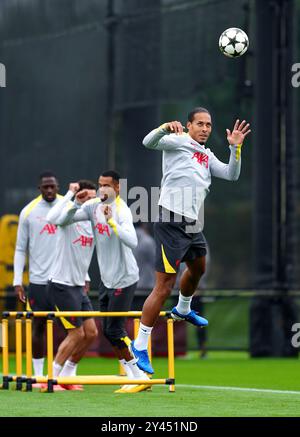 Liverpool's Virgil van Dijk heads the ball clear from Tottenham Hotspur ...