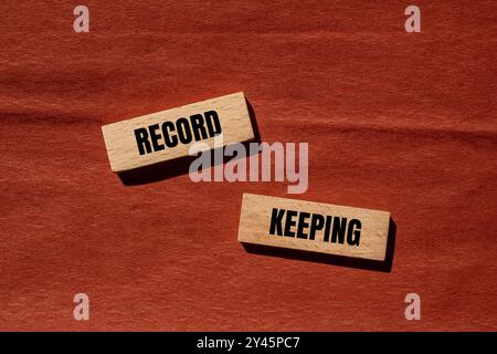 Record keeping message written on ripped torn red paper with yellow background. Conceptual ...