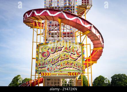 Super high Helter Skelter slide ride at British carnival funfair on ...