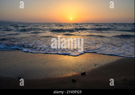 Panoramic sunset seascape with paddle boarders and motor boat near St ...