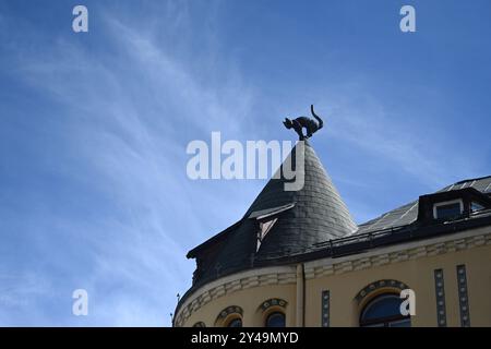 Cat House in Riga, Latvia. The cat sculpture on the roof of Cat House ...