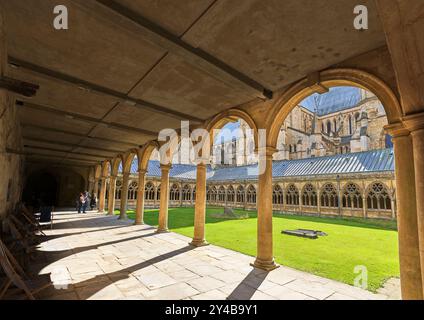 Covered walkway around the cloister garden in Lincoln cathedral ...