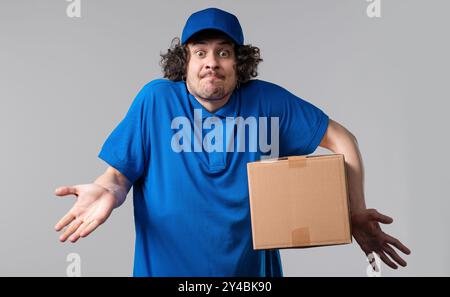 Confused postal courier man, shoulders up - can't help,makes gesture I ...