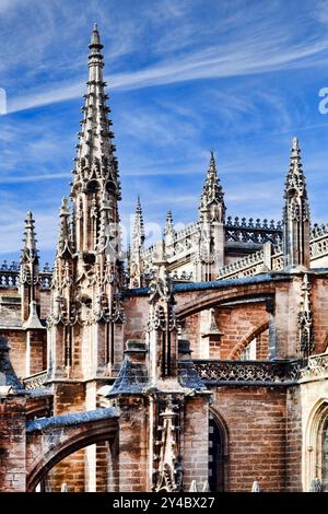 Sevilla Cathedral in Spain showcases a stunning Gothic entrance with ornate carvings under a ...