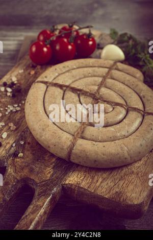 Raw spiral sausage from pork and beef mince meat. White background. Top ...