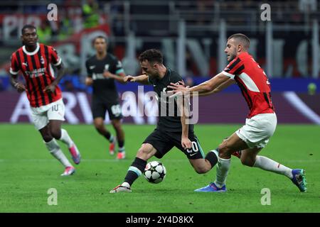 AC Milan's Strahinja Pavlovic, right, vies for the ball with Inter Milan's Marcus Thuram during ...