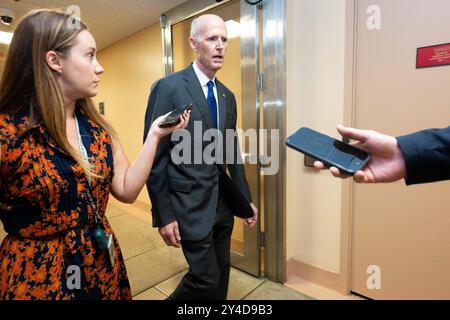 Senator Rick Scott (R-FL) speaks with visitors at the U.S. Capitol, in ...