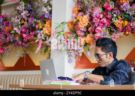 Young businessman or student studying the science and paper planes fly ...