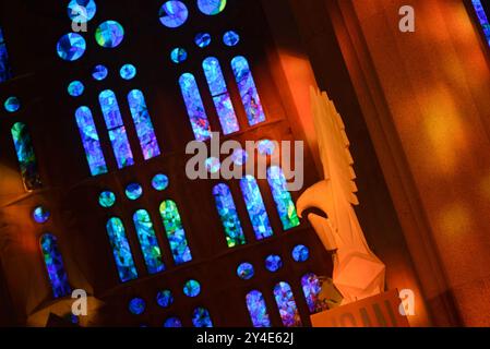 Interior of the church angel sculpture stained windows Stock Photo - Alamy