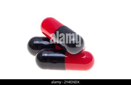 red black capsules isolated on white background Stock Photo - Alamy