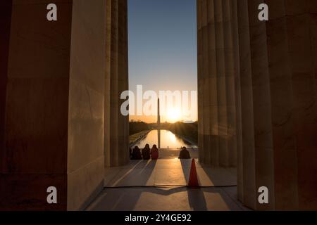 The sun rises near the Washington Monument Wednesday, July 1, 2026, in ...