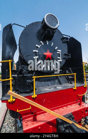 Vintage black steam locomotive train rush railway. The concept of tourism is a retro journey by ...