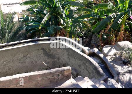 The falaj (typical small canal irrigation system) Misfah (Oman Stock ...