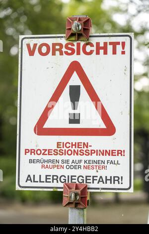 Warning of the oak processionary moth, in a public park, touching can ...