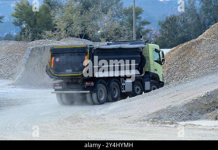 Big truck tipper drives in a quarry Stock Photo - Alamy