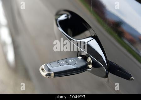 Car key inserted in lock Stock Photo - Alamy