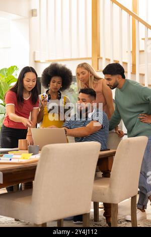 Group of students collaborating on a project in a classroom Stock Photo ...
