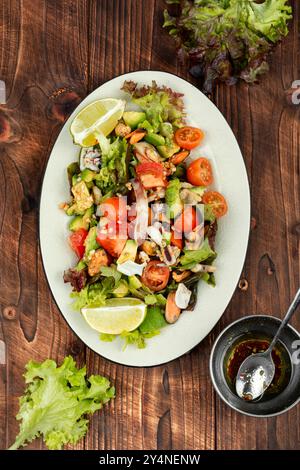 Avocado and crayfish mixed salad on a porcelain plate Stock Photo - Alamy