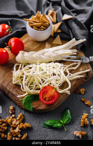 Traditional handmade Slovakian korbacik string Cheese Stock Photo - Alamy
