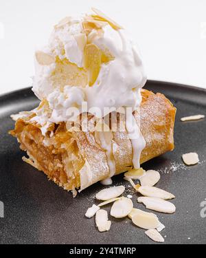 traditional apple strudel with raisins, served on a wooden board Stock ...