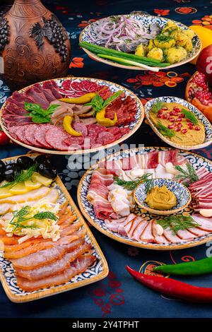 Plates with different kinds of cheese on table at buffet Stock Photo ...